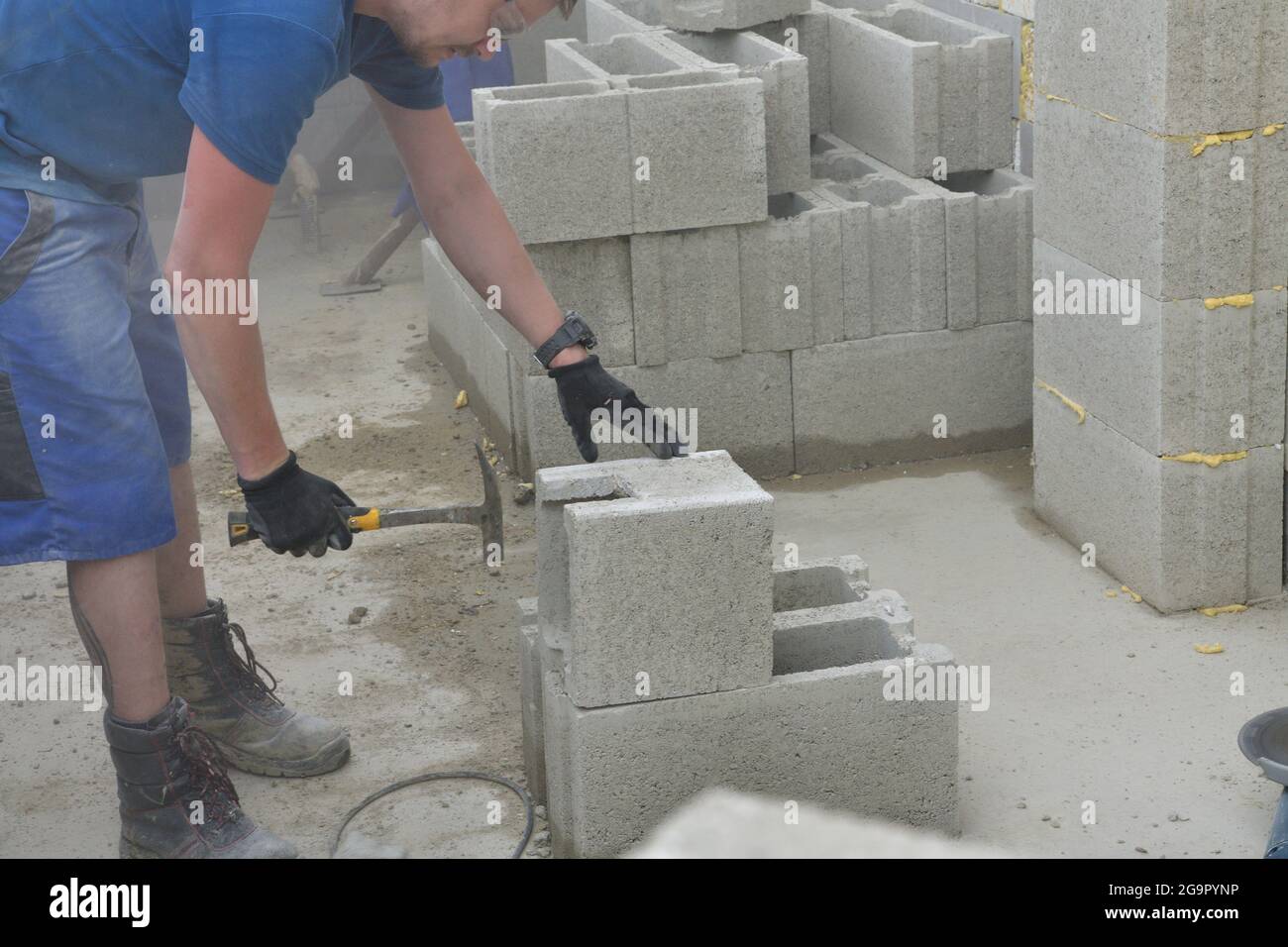 The traditional domestic way of wall masonry using concrete blocks ...