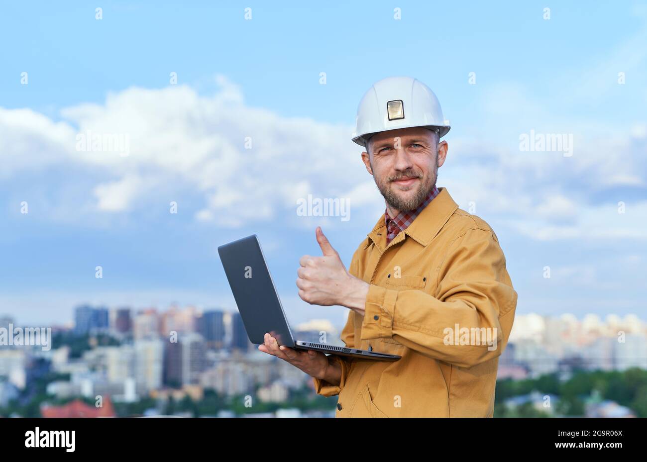 Bearded caucasian chief engineer or construction architect in white ...