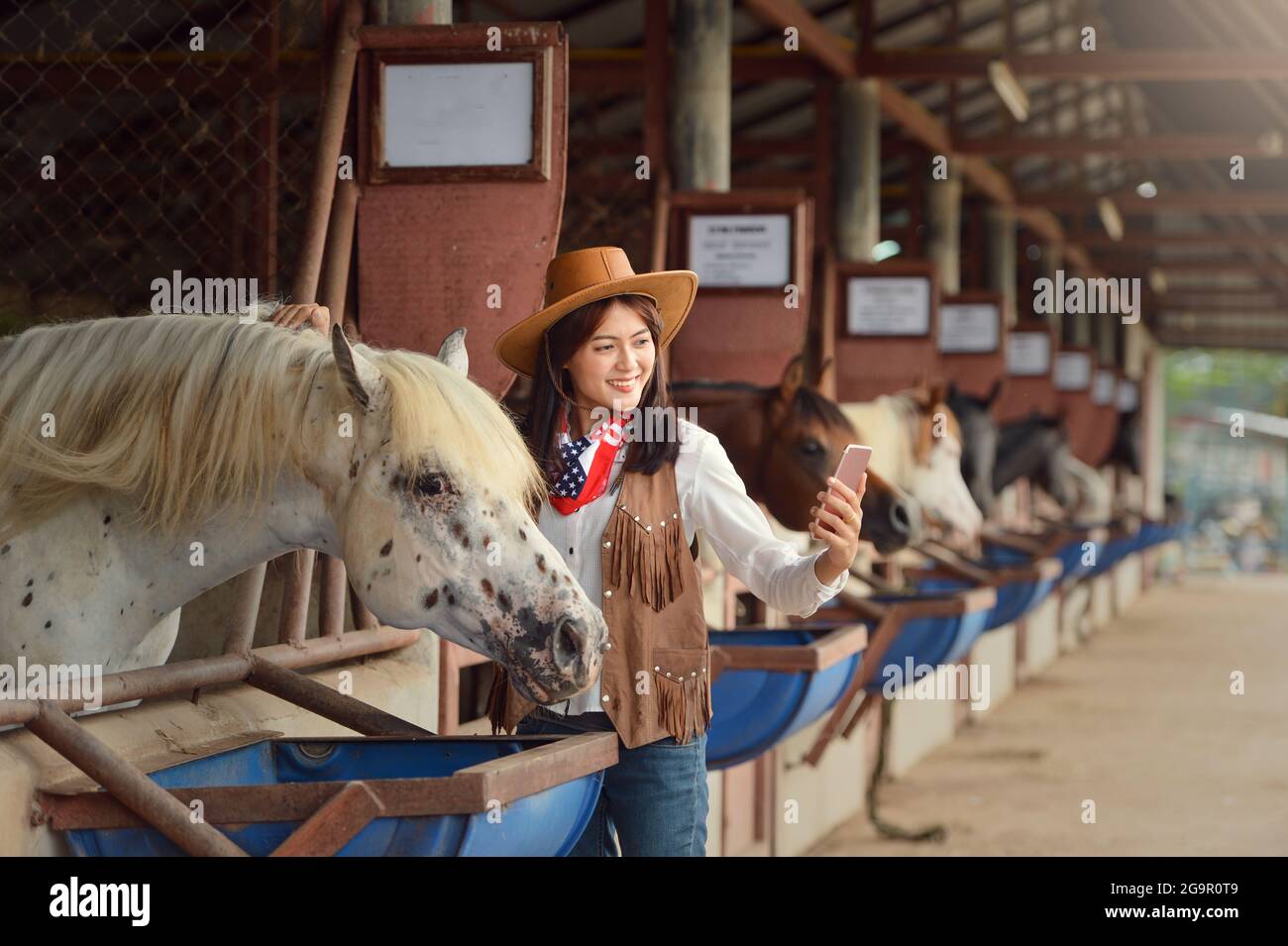 Cowgirl working stables.Concept of retro woman in horse ranch.vintage ...