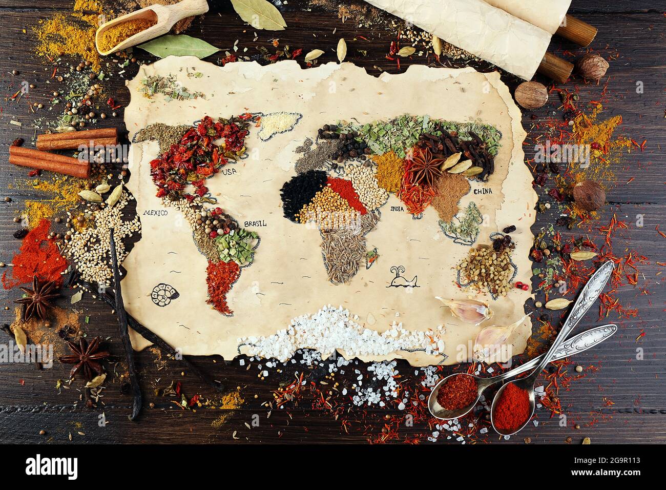 Map of world made from different kinds of spices on wooden background ...
