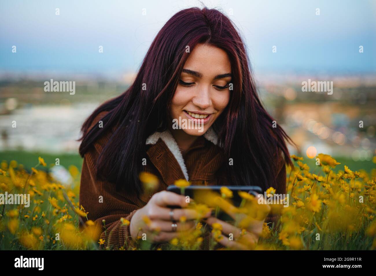 Teen girl lying in field hi-res stock photography and images - Alamy