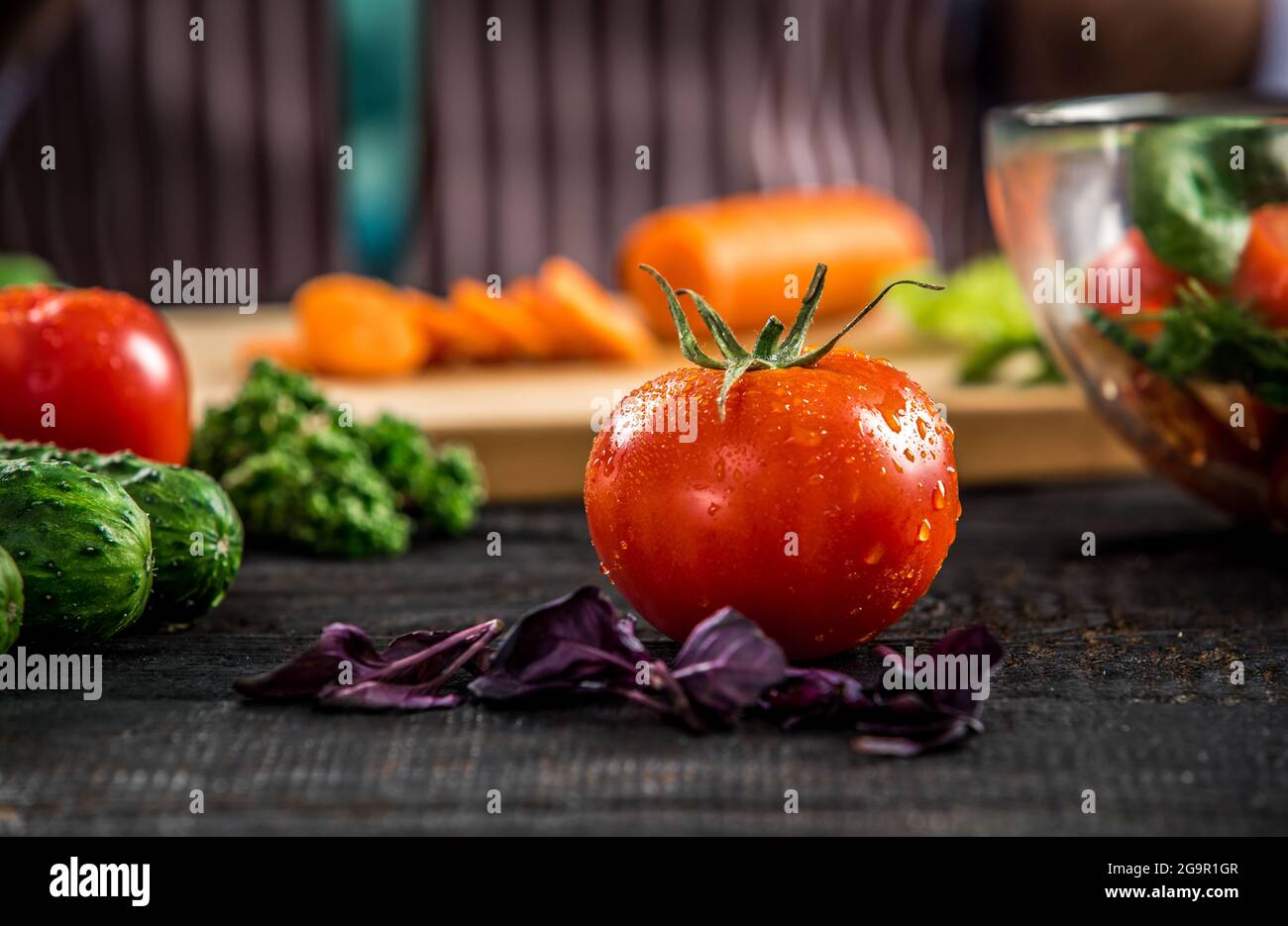 Close up tomato, making salad. Chief cutting vegetables. Healthy ...