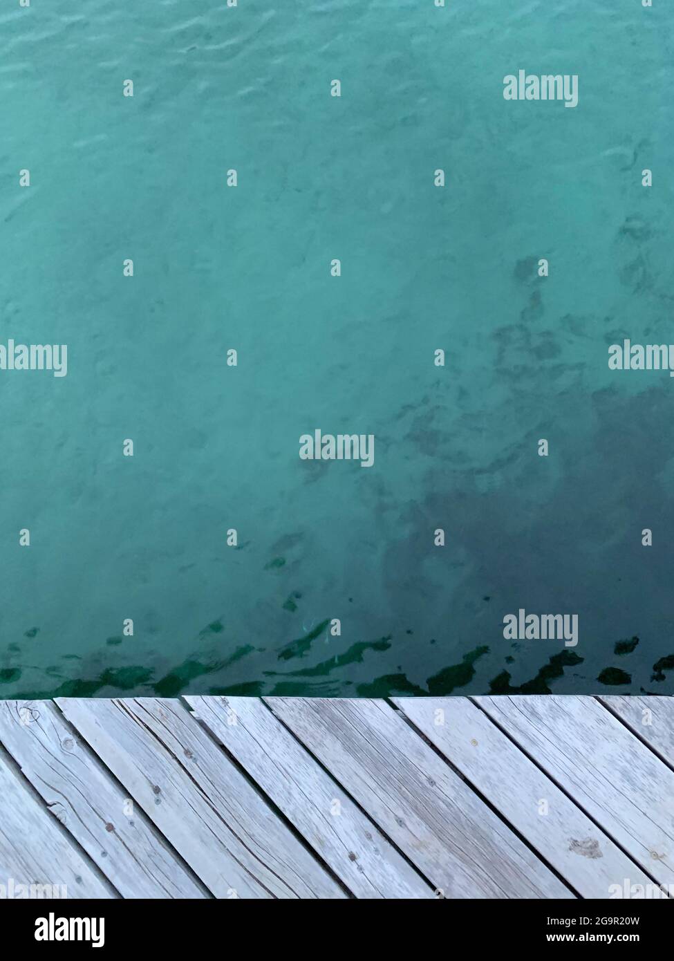 Edge of dock against clear turquoise water at Redfish Lake, Idaho Stock ...
