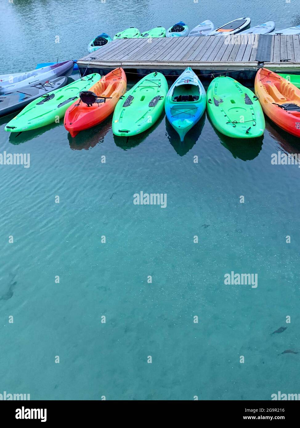 Rental Kayaks docked at marina at Redfish Lake at sundown Stock Photo ...