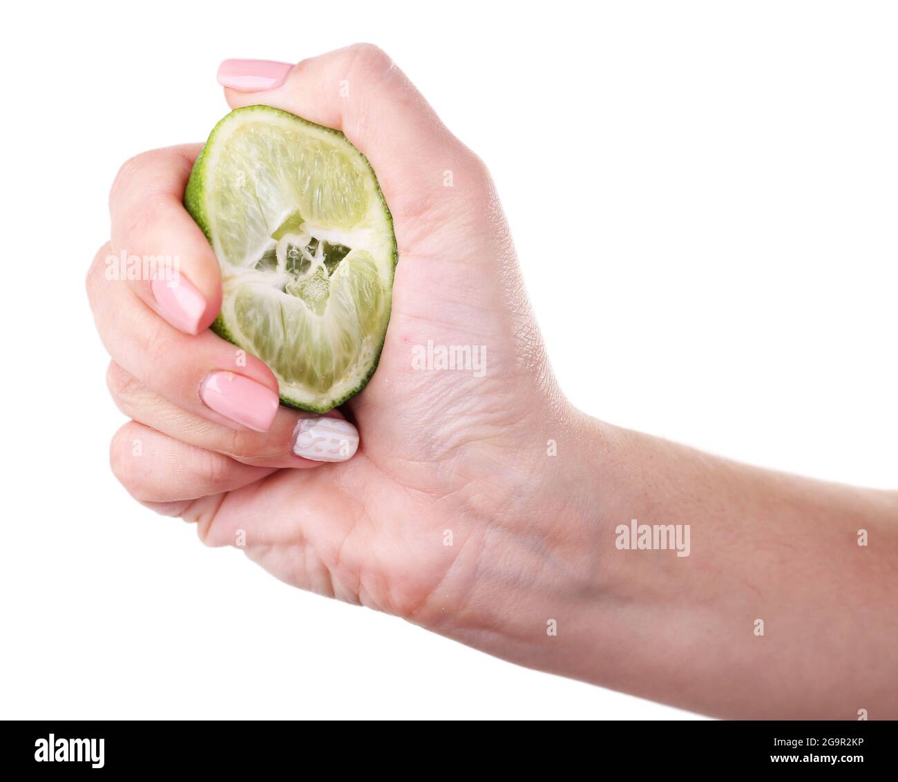 Female hand squeezing lime isolated on white Stock Photo - Alamy
