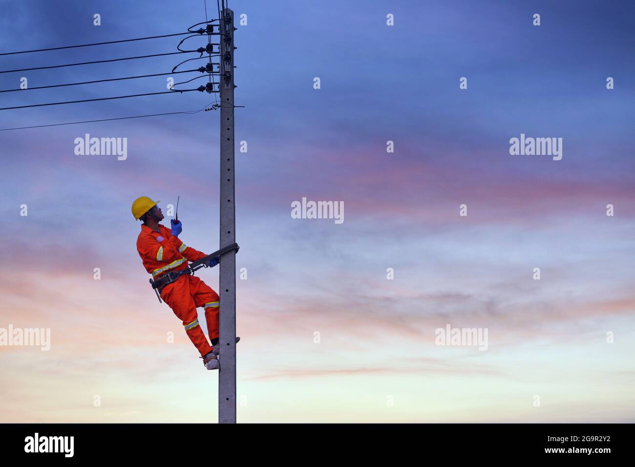 Man working on high voltage power lines hi-res stock photography and ...