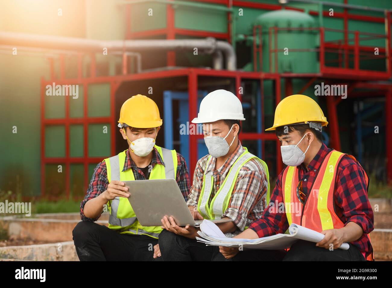 engineer discusses technical documentation with his help in the ...