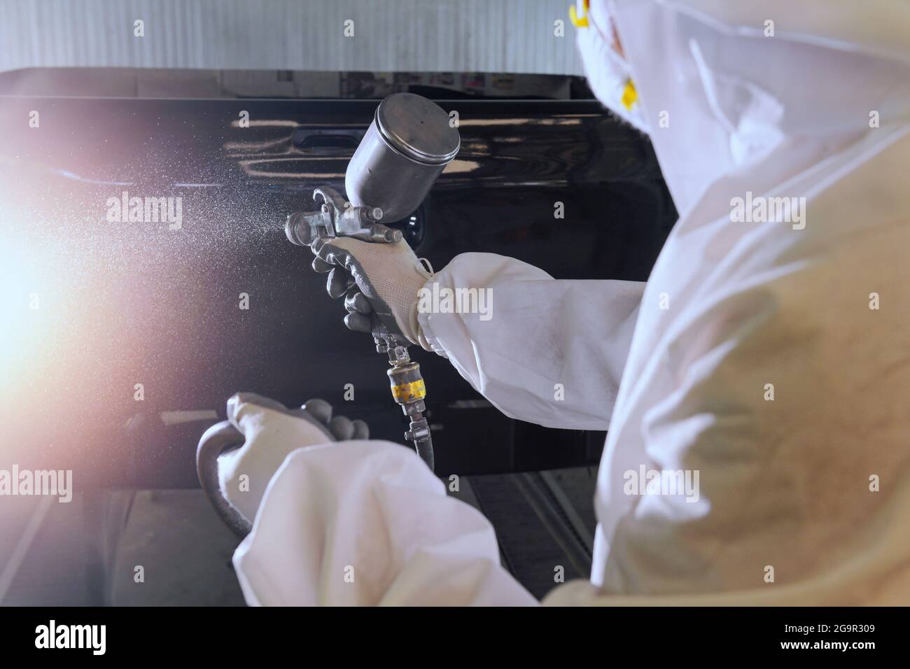 Repair and painting car mechanic.worker painting a car Stock Photo - Alamy