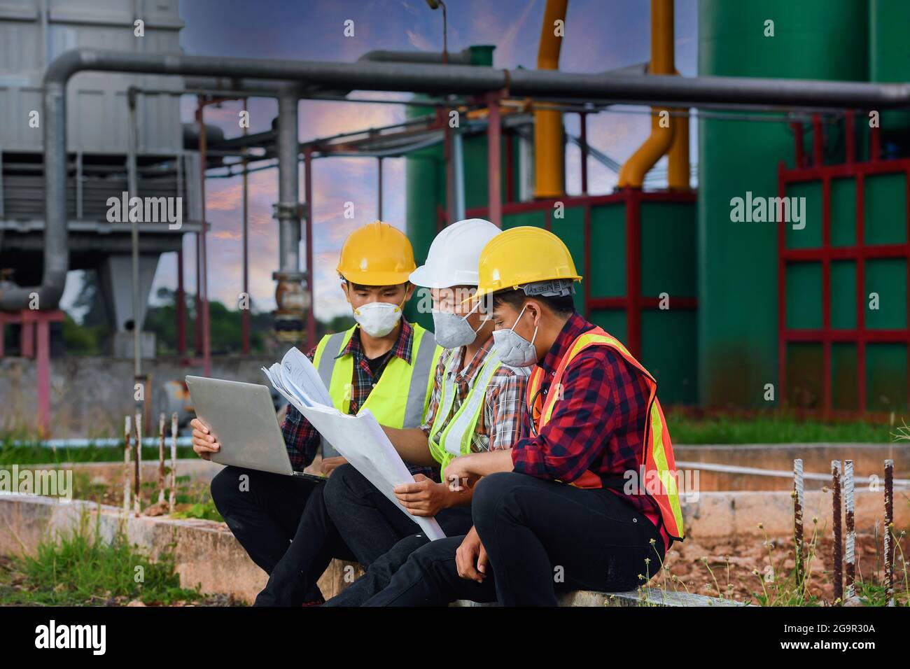 engineer discusses technical documentation with his help in the ...