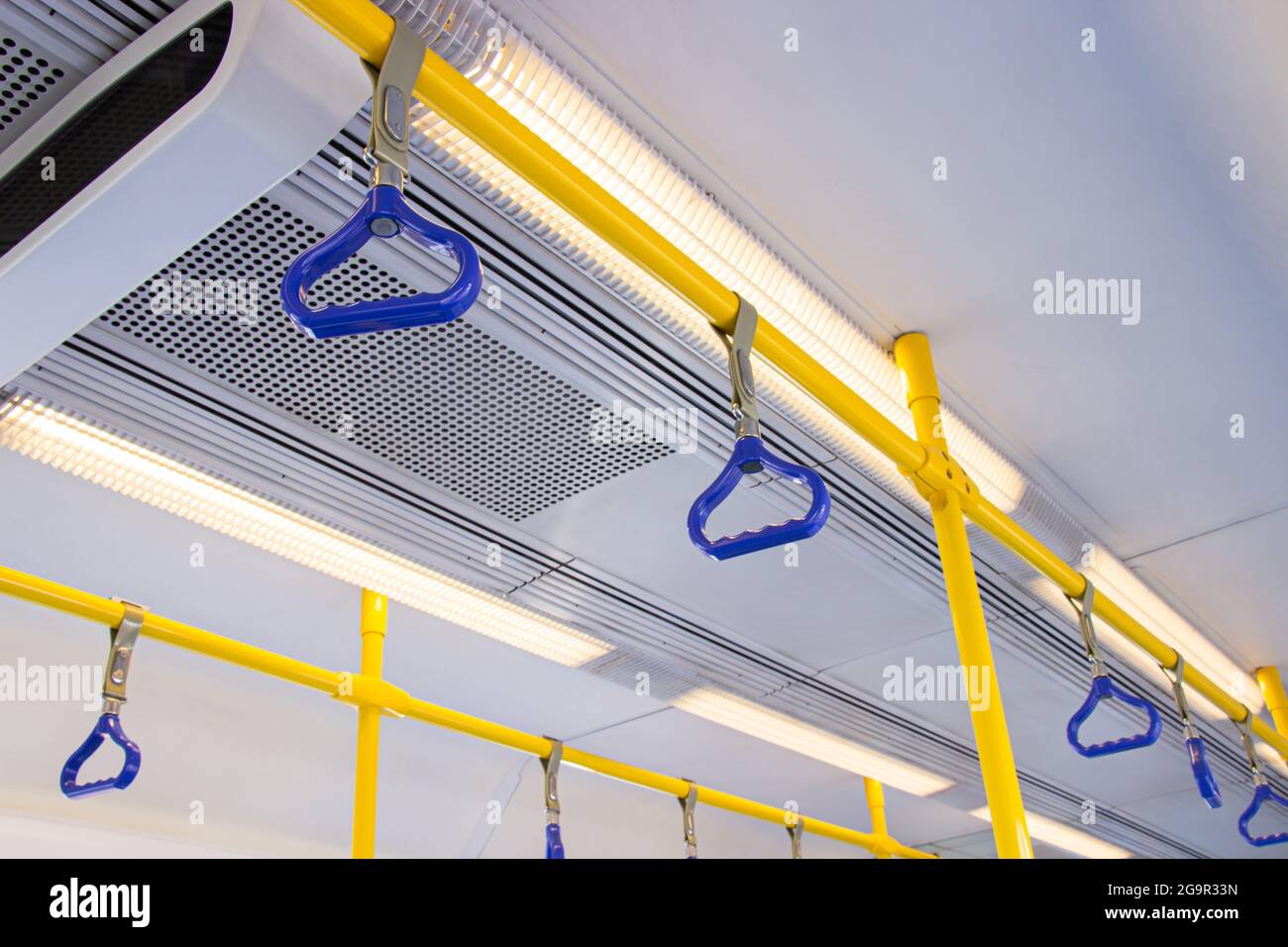 Blue hand holder for the passenger inside of public bus used for safety ...