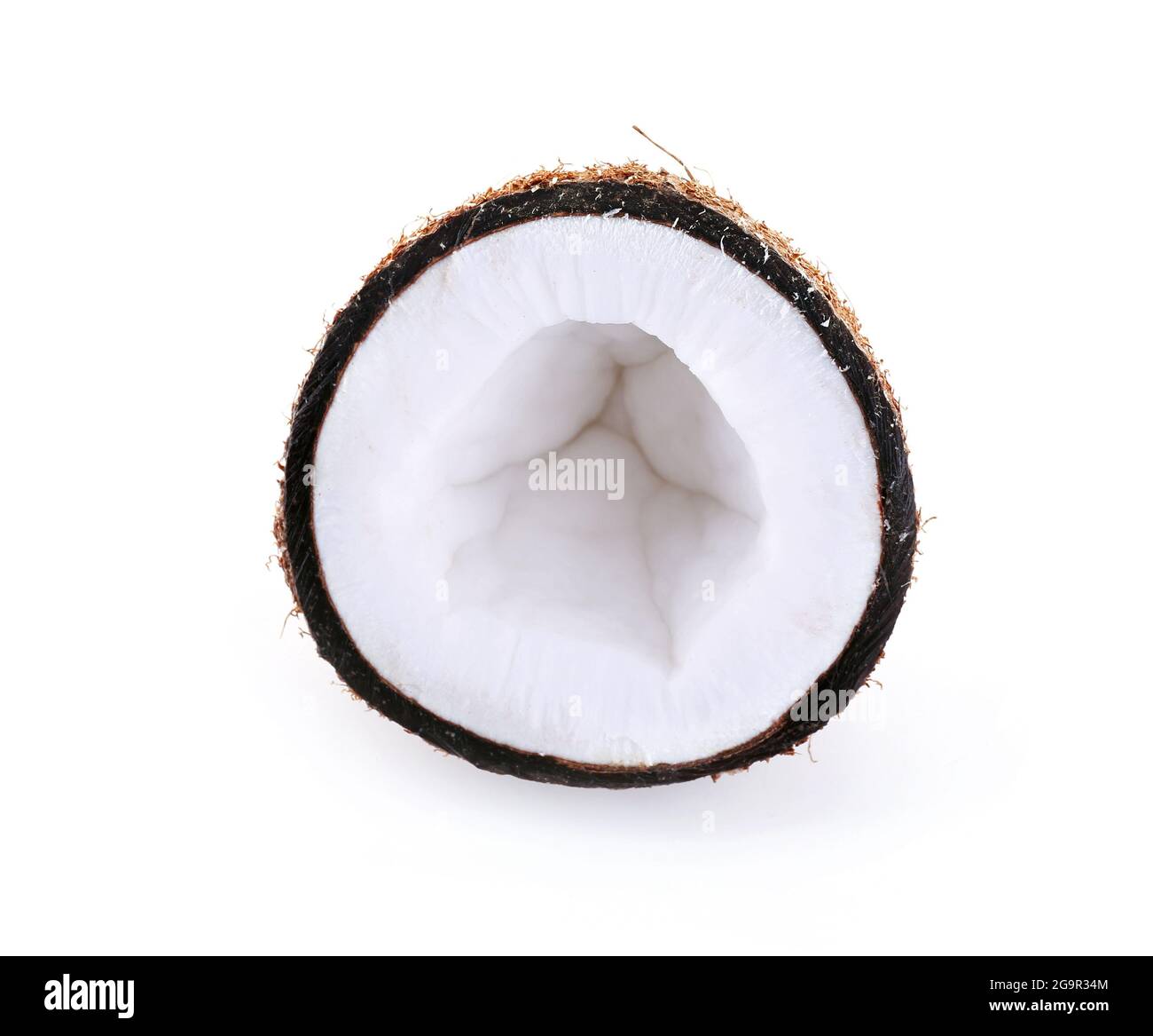 Coconut cut in half isolated on white background Stock Photo - Alamy