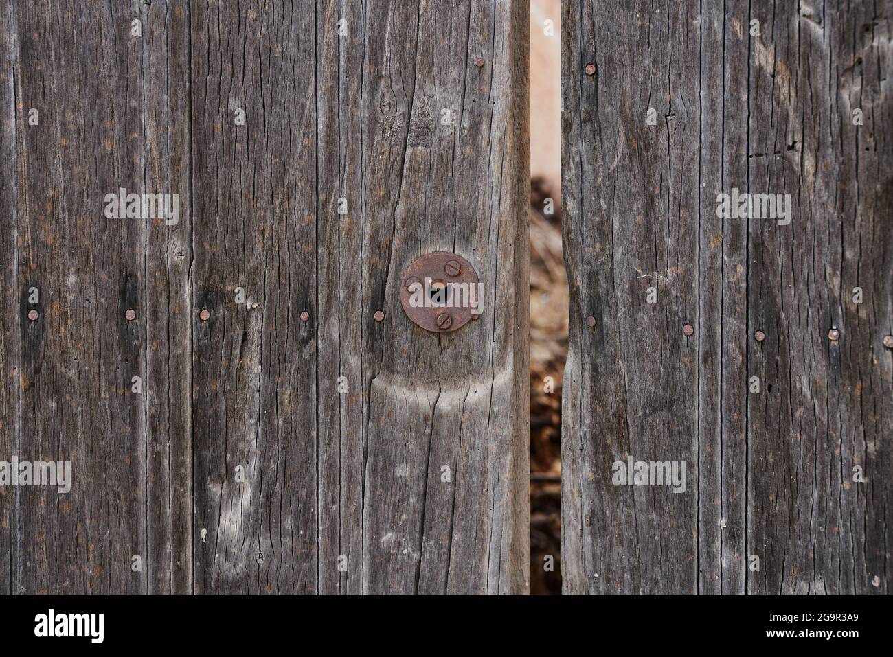 Antique wooden door with rusted hardware Stock Photo - Alamy