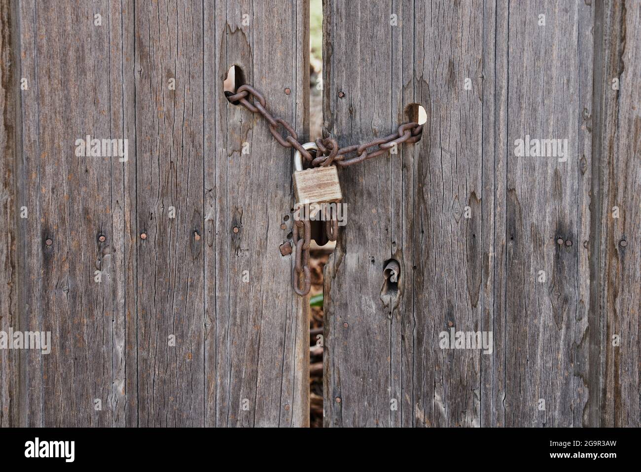 Antique wooden door with rusted hardware Stock Photo - Alamy