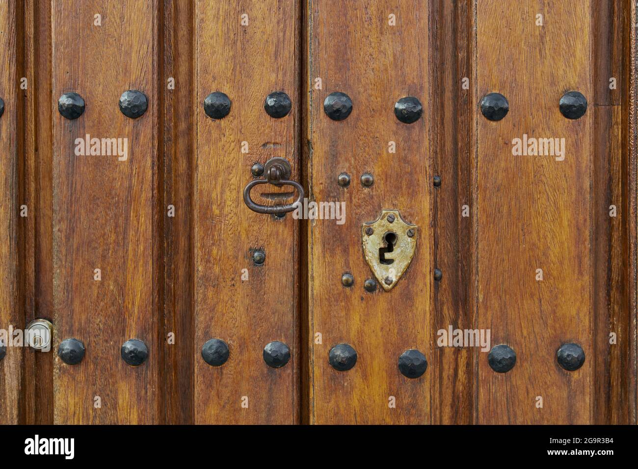 Antique wooden door with rusted hardware Stock Photo - Alamy