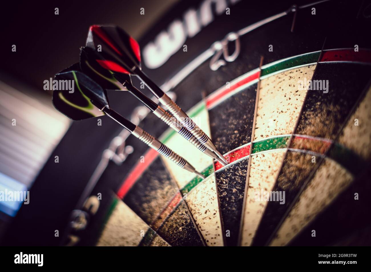 metal-tipped darts stuck in a competition cork dartboard Stock Photo ...