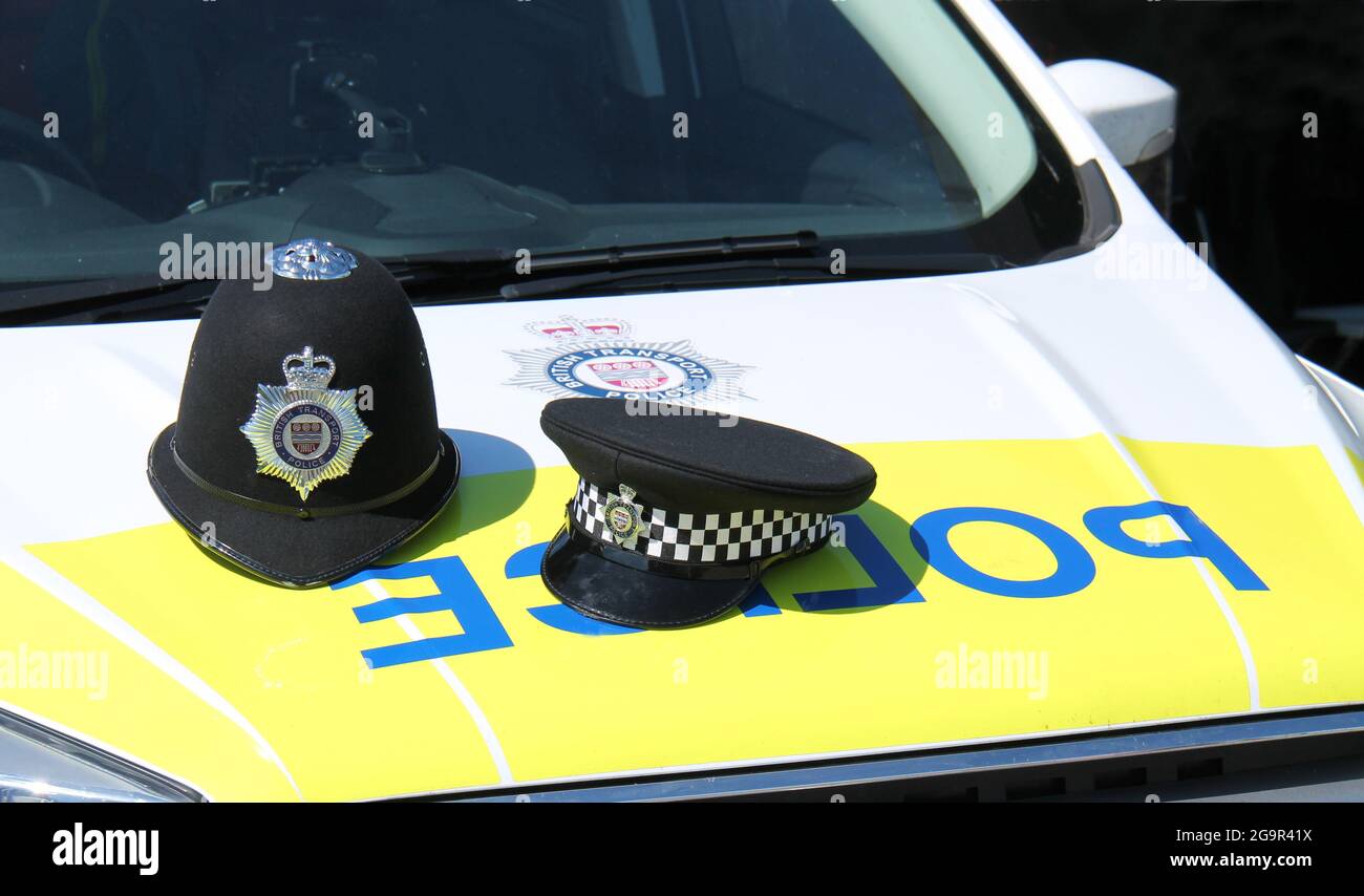 Two Transport Police Hats on a Patrol Car Bonnet Stock Photo - Alamy