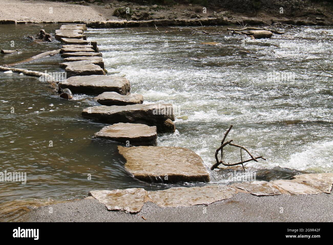 A Set of Rock Stepping Stones Across a Wide River Stock Photo - Alamy