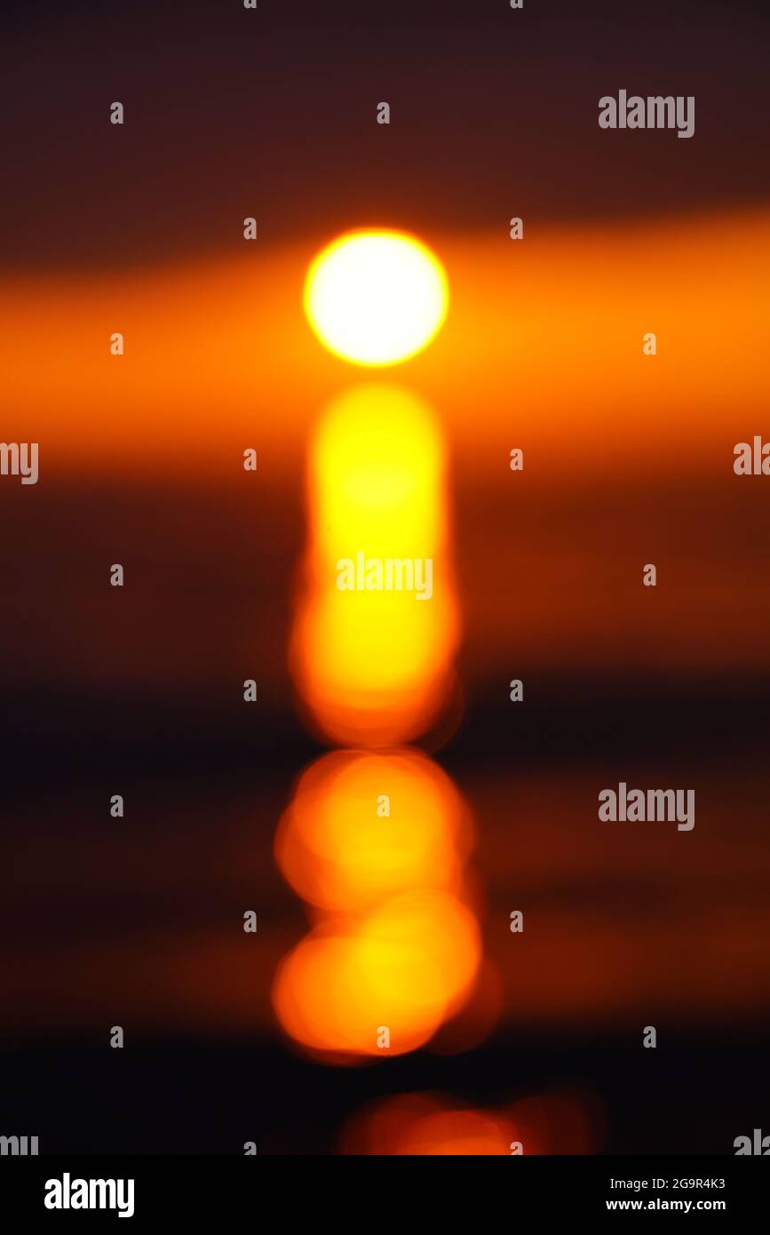 orange sun out of focus Stock Photo - Alamy
