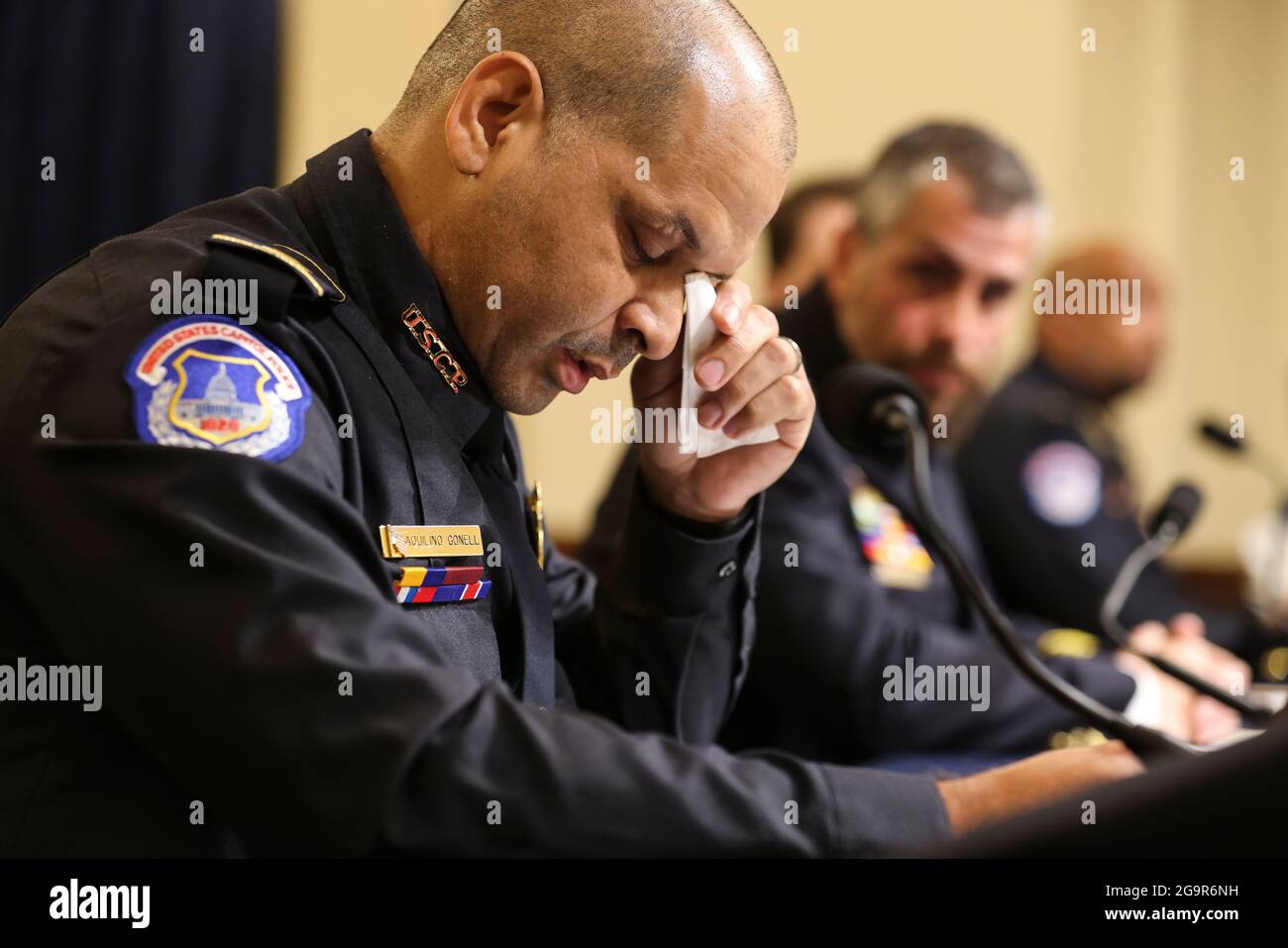 U.S. Capitol Police officer Sgt. Aquilino Gonell becomes emotional as ...