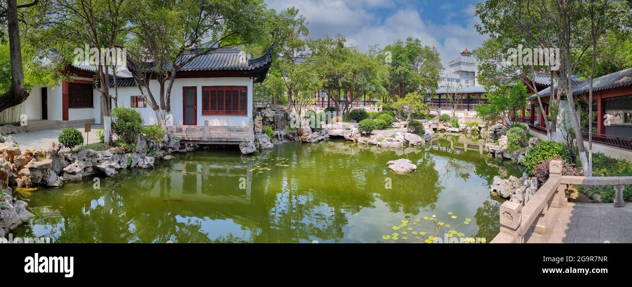 Chinese classical courtyard with small bridge and water Stock Photo - Alamy