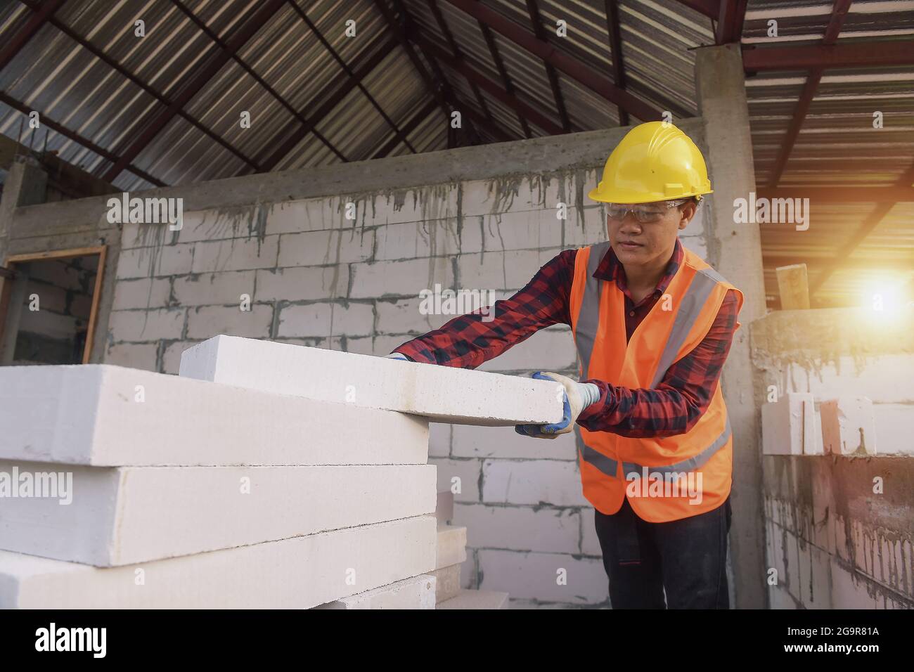Construction mason worker bricklayer ,construction worker laying bricks ...
