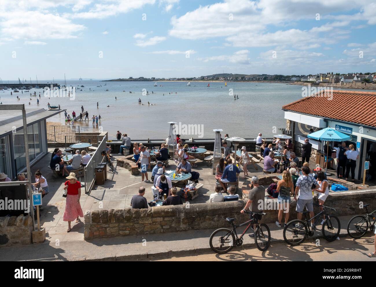 Customers enjoy fine weather in the Beer Garden of the The Ship Inn ...