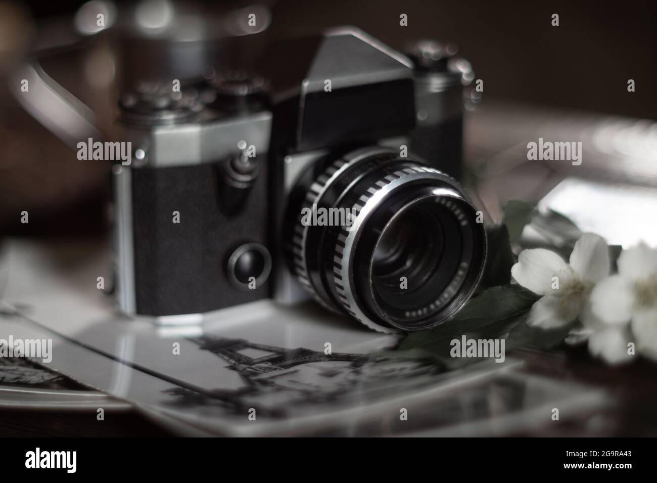 Old outdated camera and black and white photo in retro style Stock ...
