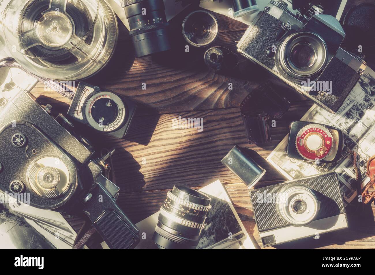 Old outdated movie cameras, photo cameras, lenses and exposure meters ...