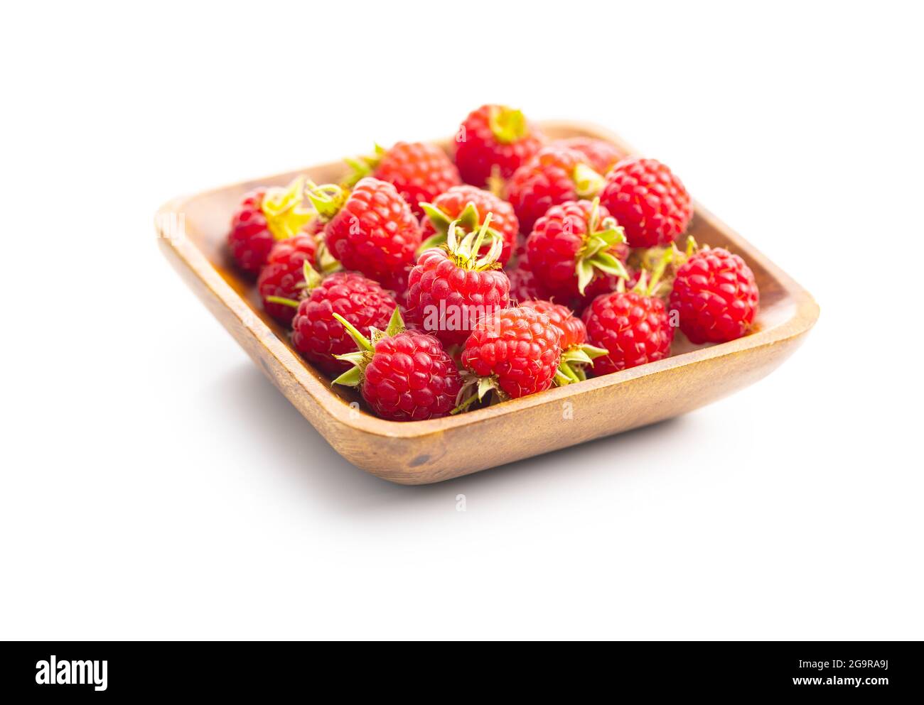 Fresh red raspberries in bowl isolated on white background Stock Photo ...