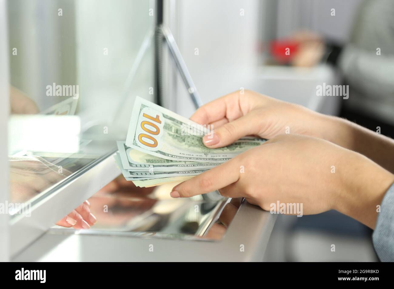 Female hand with money in cash department window. Currency exchange ...