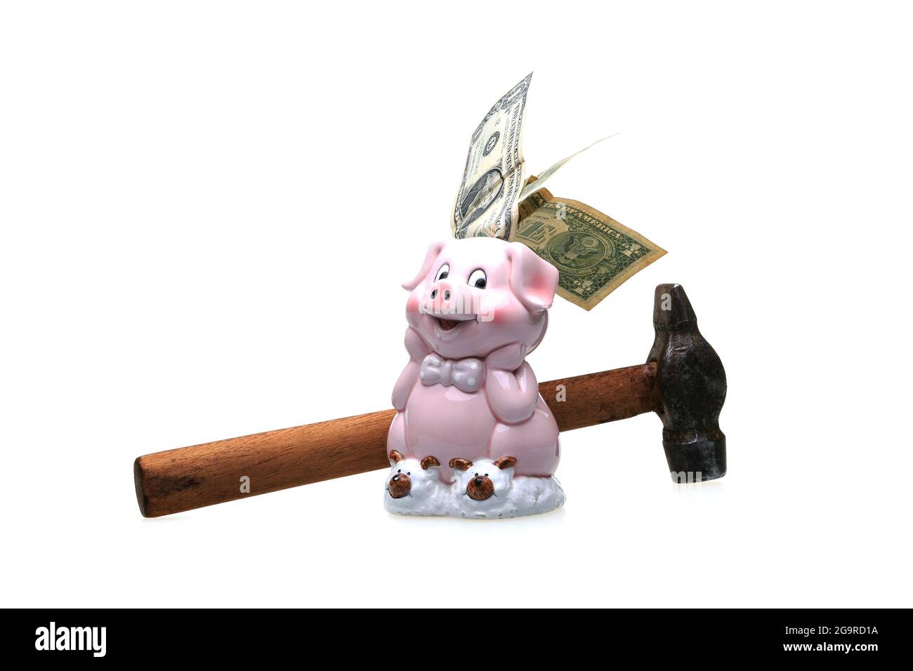 Pink piggy bank in the form of a cute pig, dollar bills and a hammer ...