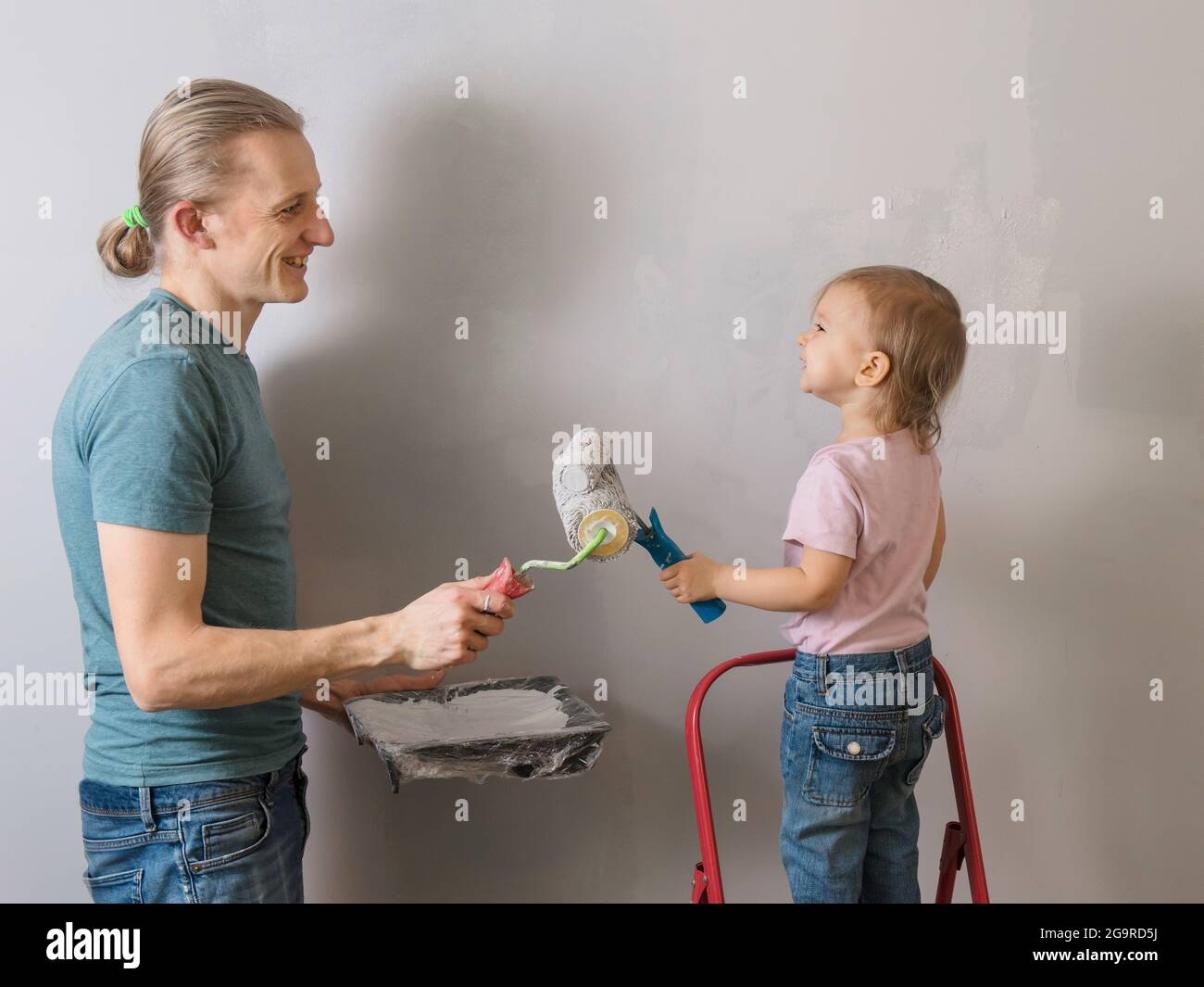 Father painting wall hi-res stock photography and images - Alamy