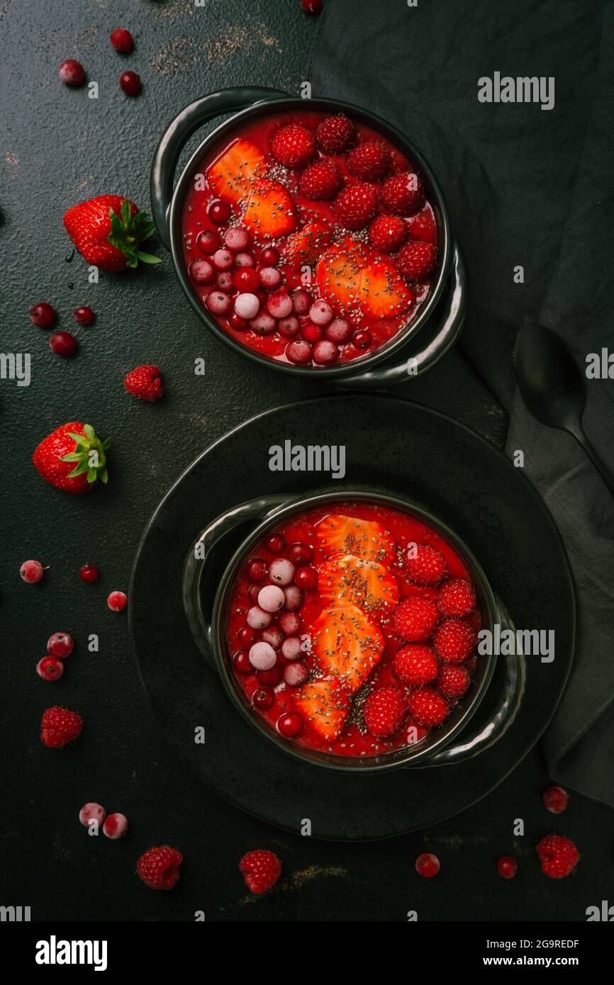 Breakfast red smoothie bowl with chia seeds, strawberry, raspberry and ...