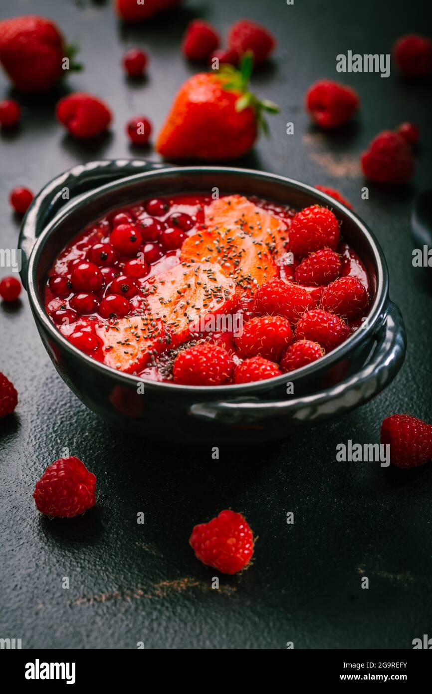 Breakfast red smoothie bowl with chia seeds, strawberry, raspberry and ...