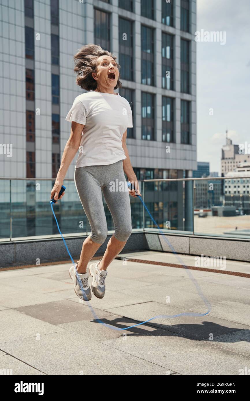 Senior woman jumping rope hi-res stock photography and images - Alamy
