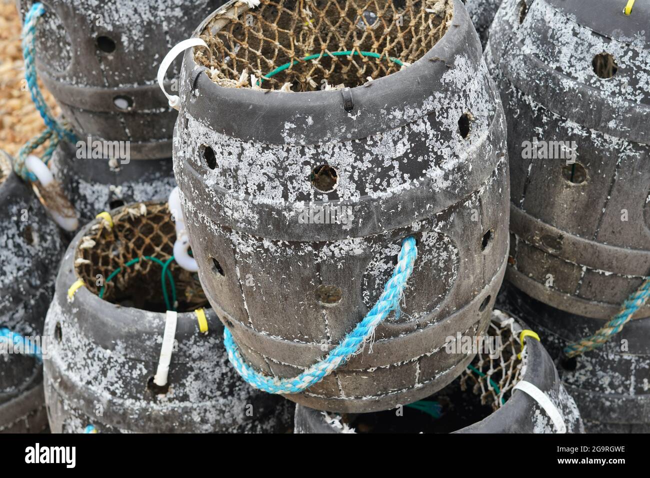 Fishing nets, lobster pots, chains and floats are strewn around the ...