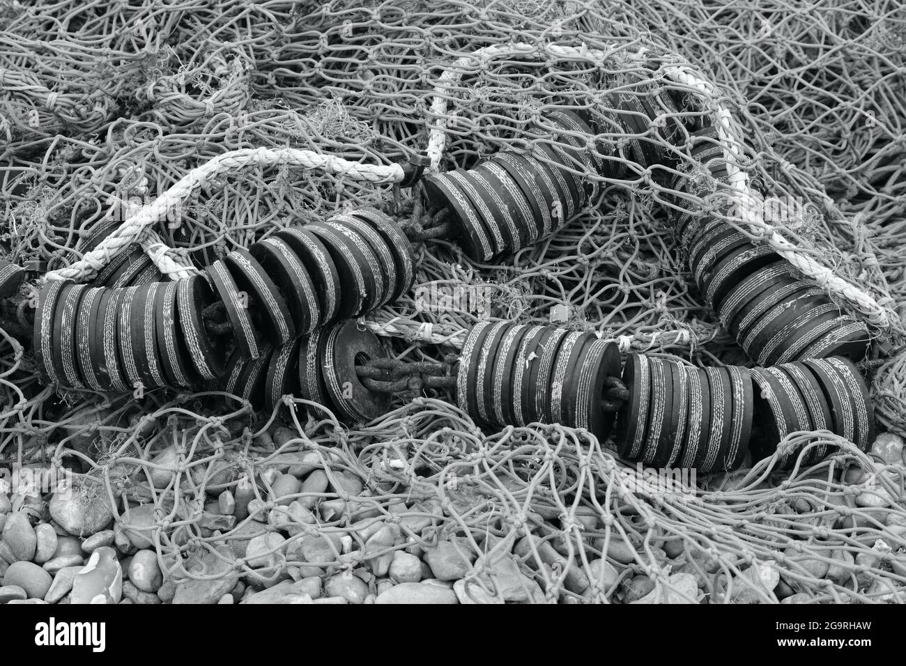 Fishing nets, lobster pots, chains and floats are strewn around the ...