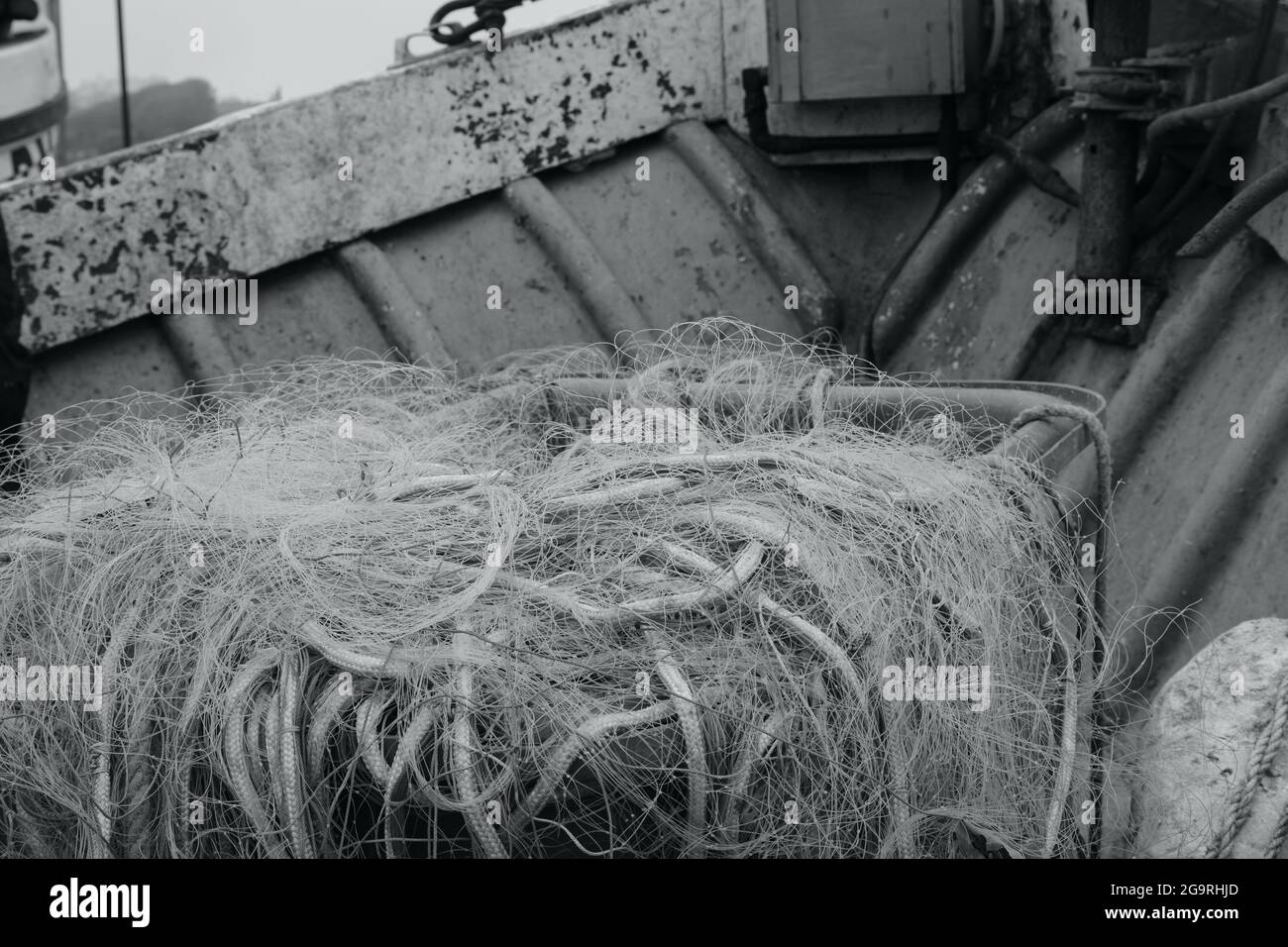 Fishing nets, lobster pots, chains and floats are strewn around the ...