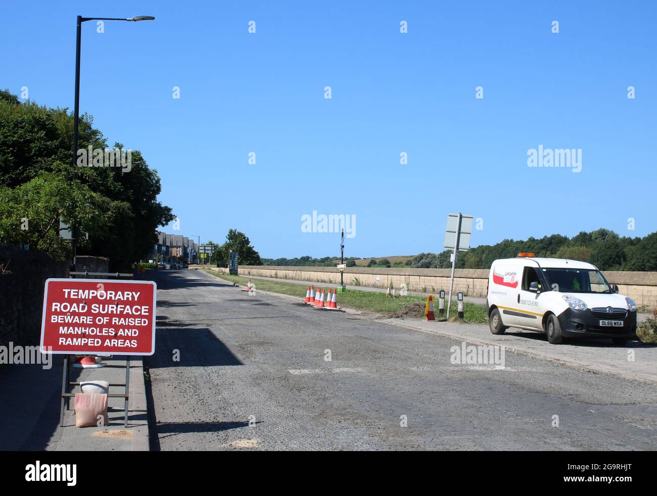 Temporary road surface in road works for resurfacing with road signs ...