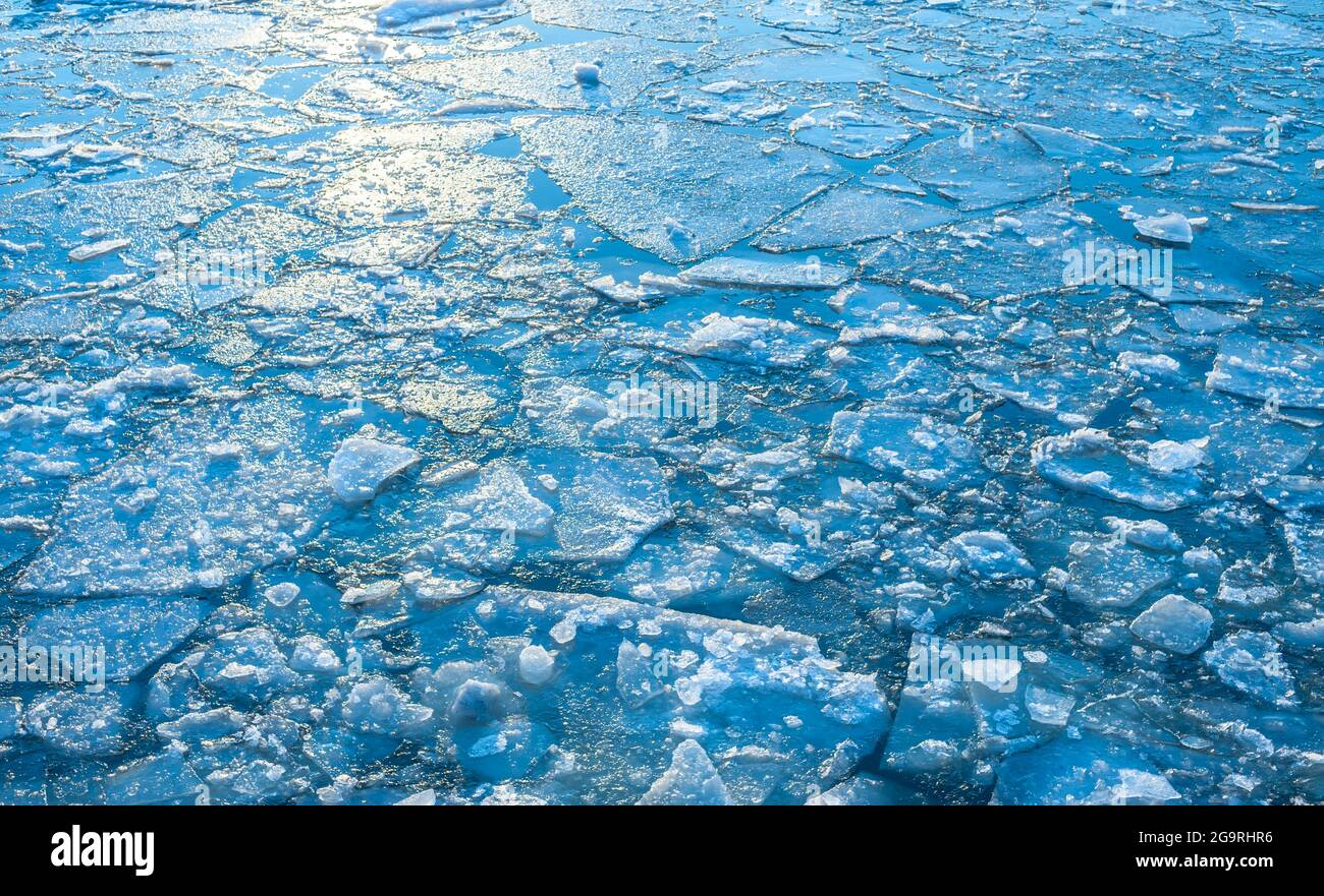 The reflection of the sun in ice formed in a river Stock Photo - Alamy
