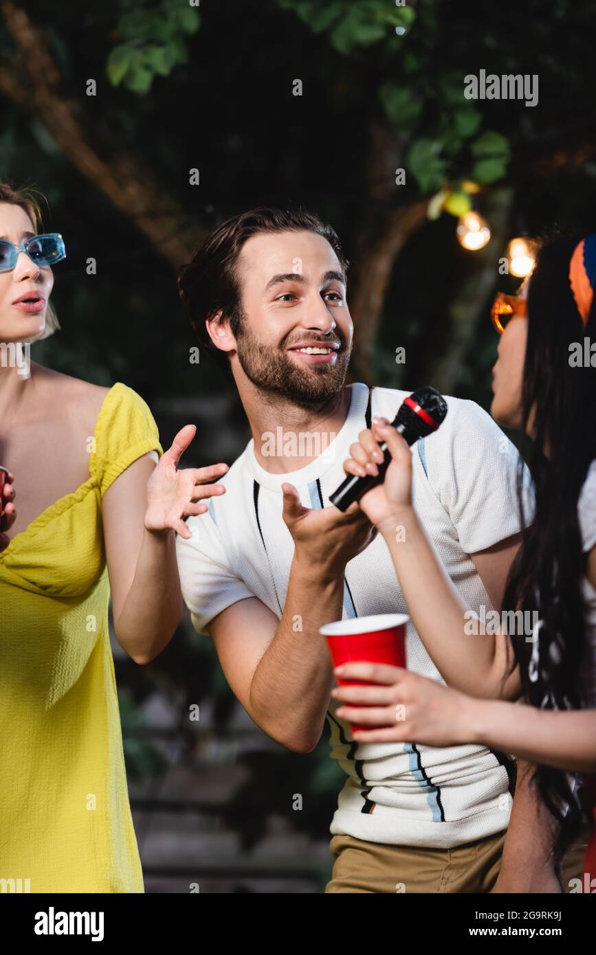 Asian young man holding microphone hi-res stock photography and images ...