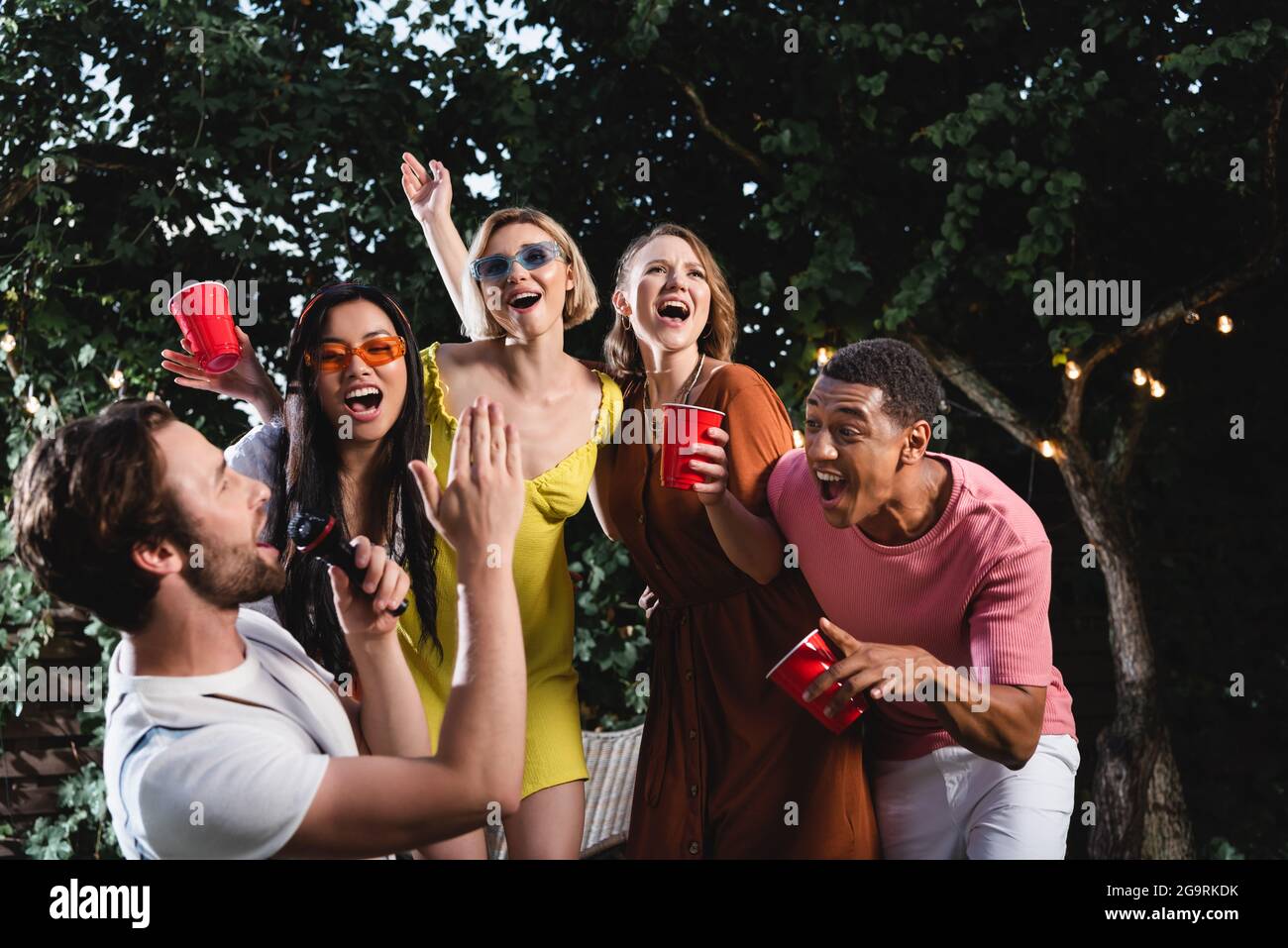 Man singing into microphone hi-res stock photography and images - Alamy
