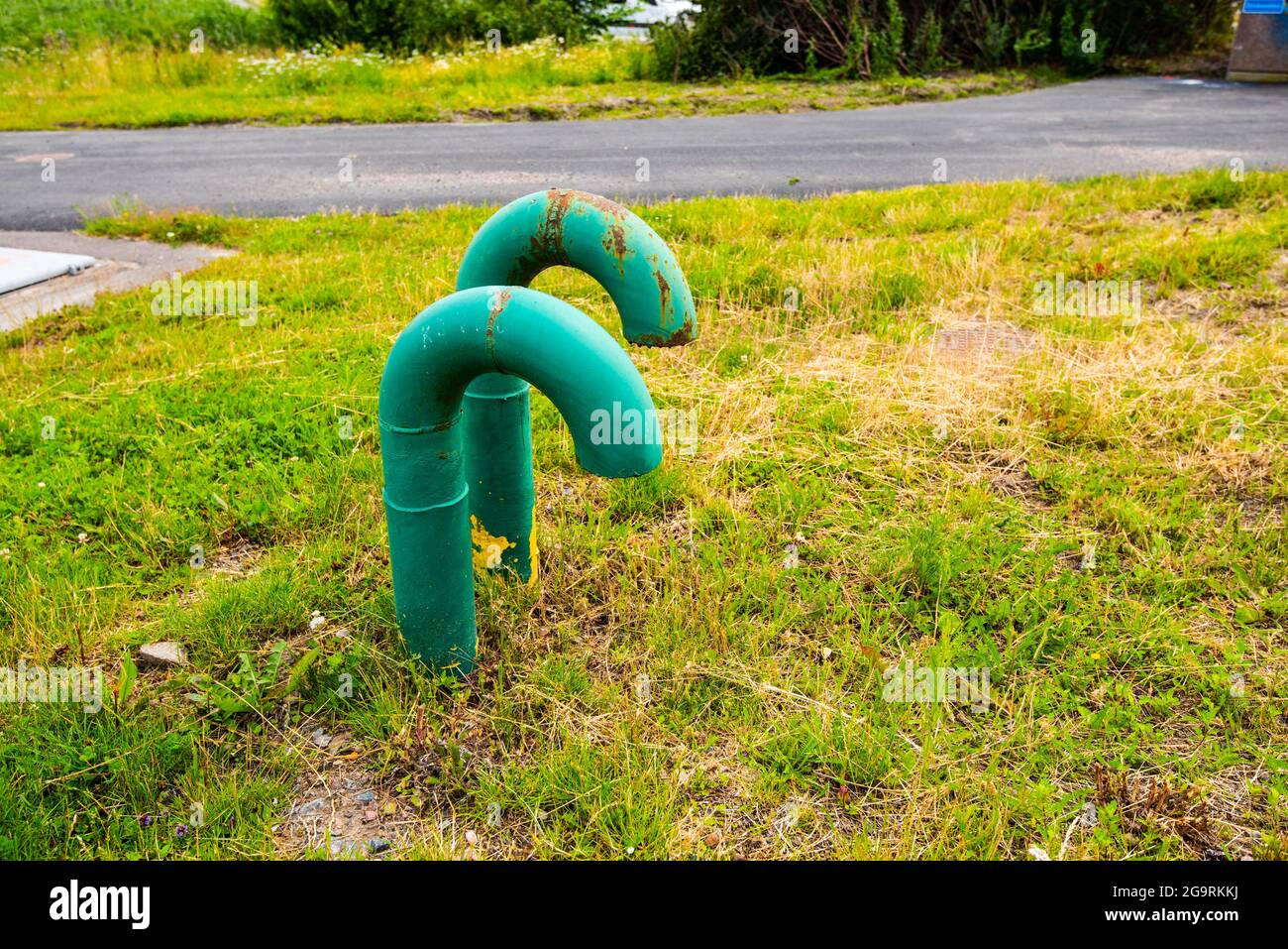 Two green vents sticking up out of the ground Stock Photo - Alamy