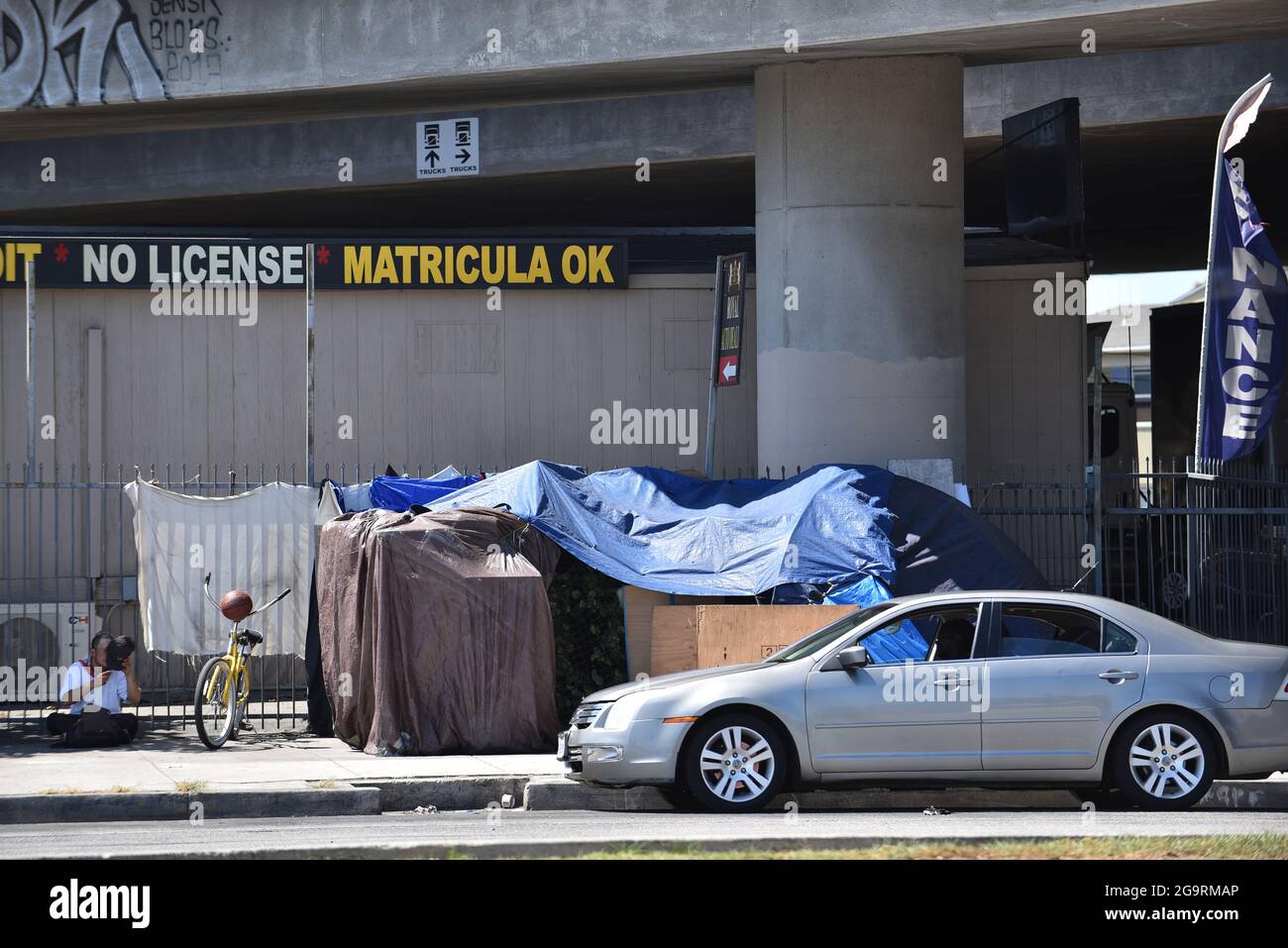 Los Angeles, CA USA - June 30, 2021: Homeless man and tent under a ...