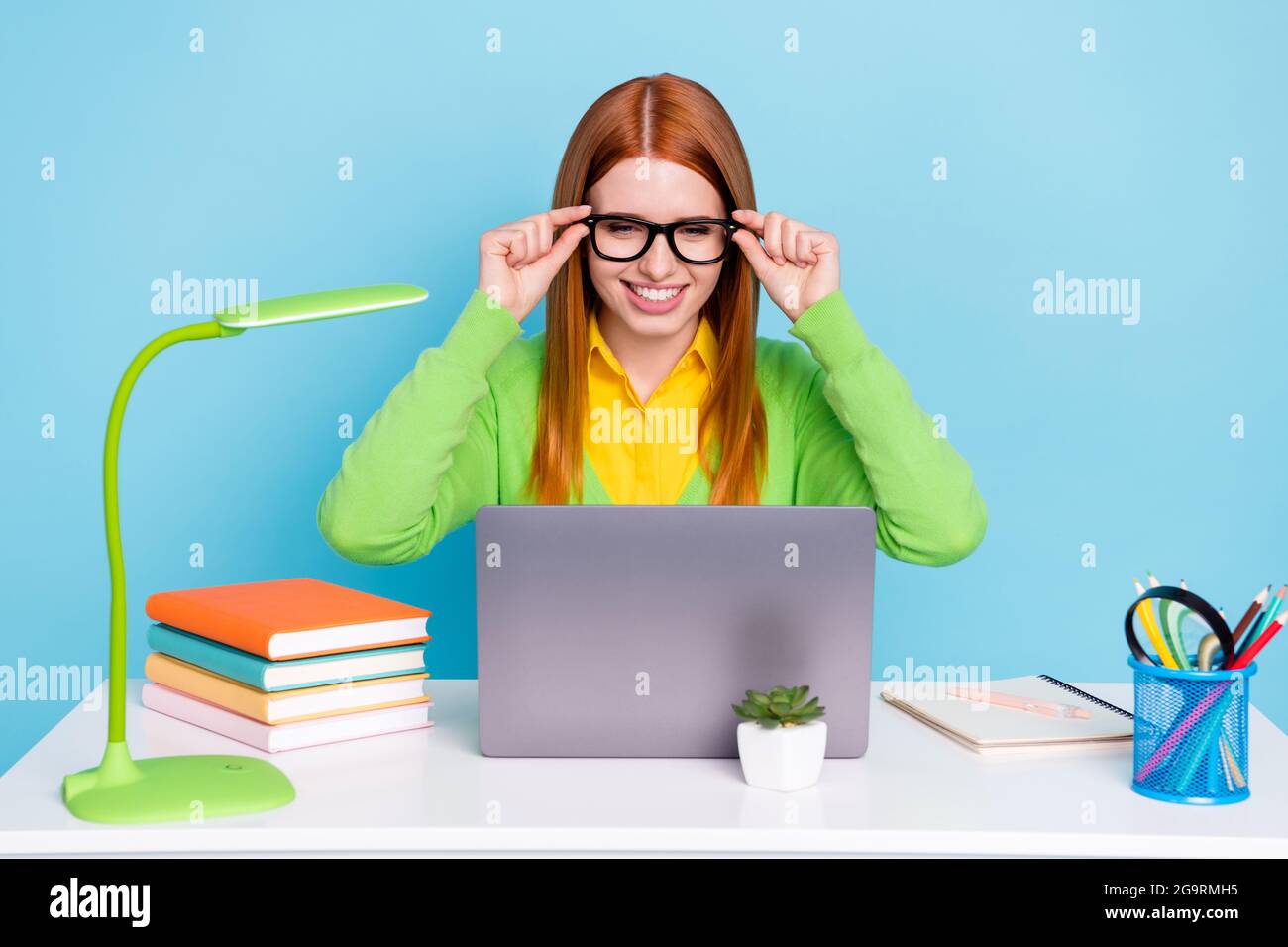 Photo of young sweet ginger lady work from home hands spectacles wear ...