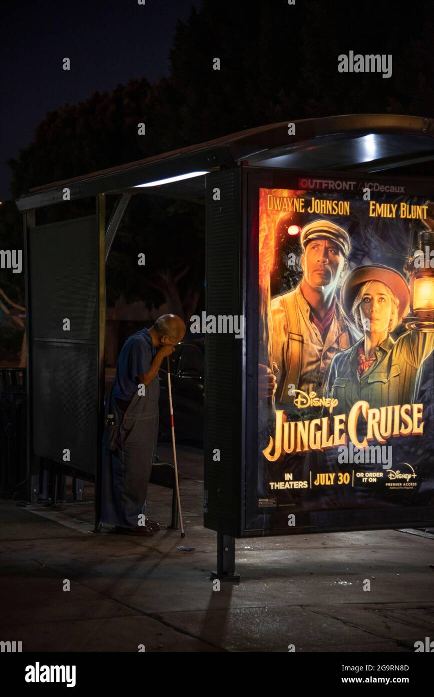 Los Angeles, CA USA - July 12, 2021: A blind homeless man at a but stop ...