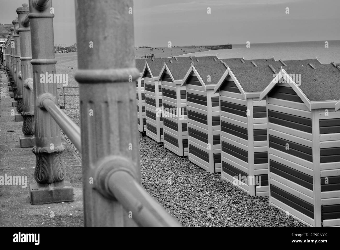 Beach huts on Hastings beach. Thes brightly coloured blue and white ...