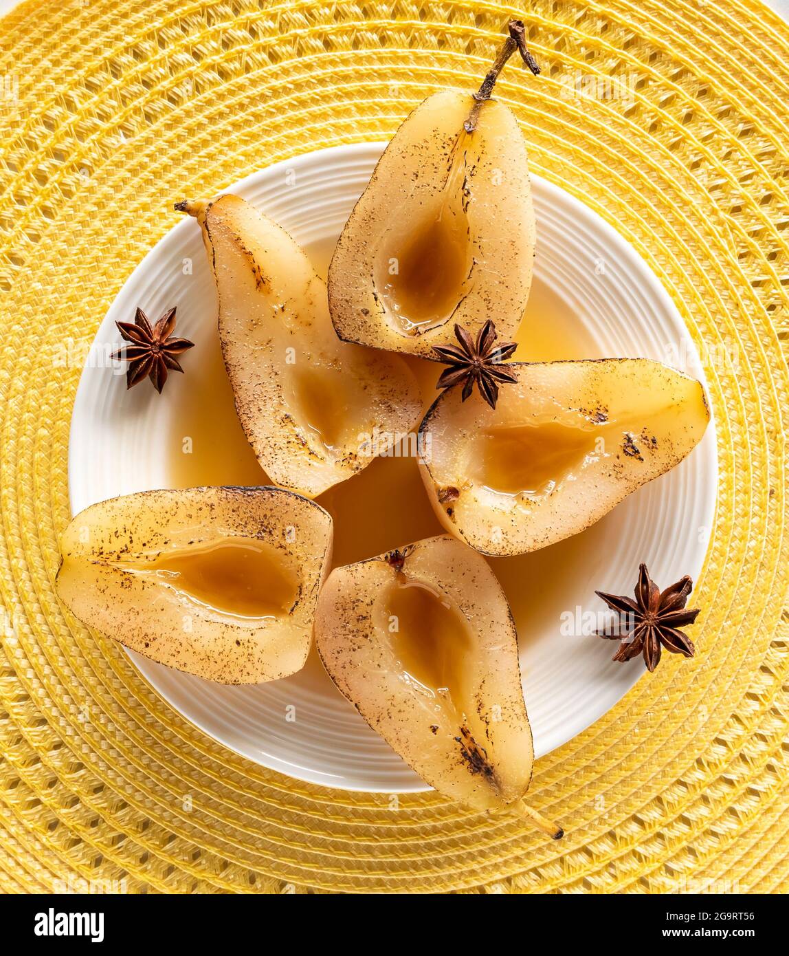 Top down view of poached and torched pears topped with a sweet glaze ...