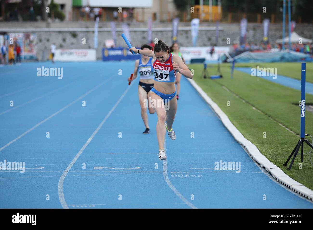 ISTANBUL, TURKEY - JUNE 13, 2021: Athletes running running 4x400 metres ...