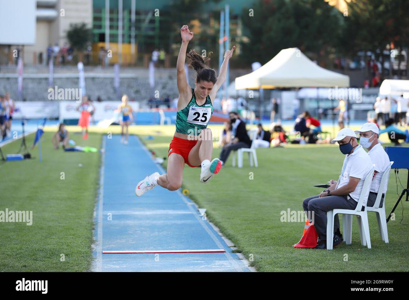 ISTANBUL, TURKEY - JUNE 13, 2021: Undefined athlete long jumping during ...